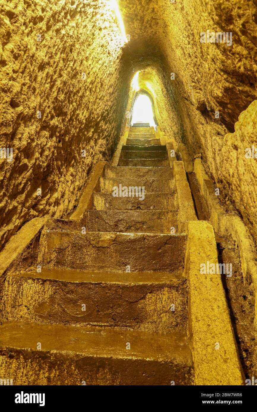 Access stairs to a cave. Stairs in a hand-carved tunnel into the Stock ...