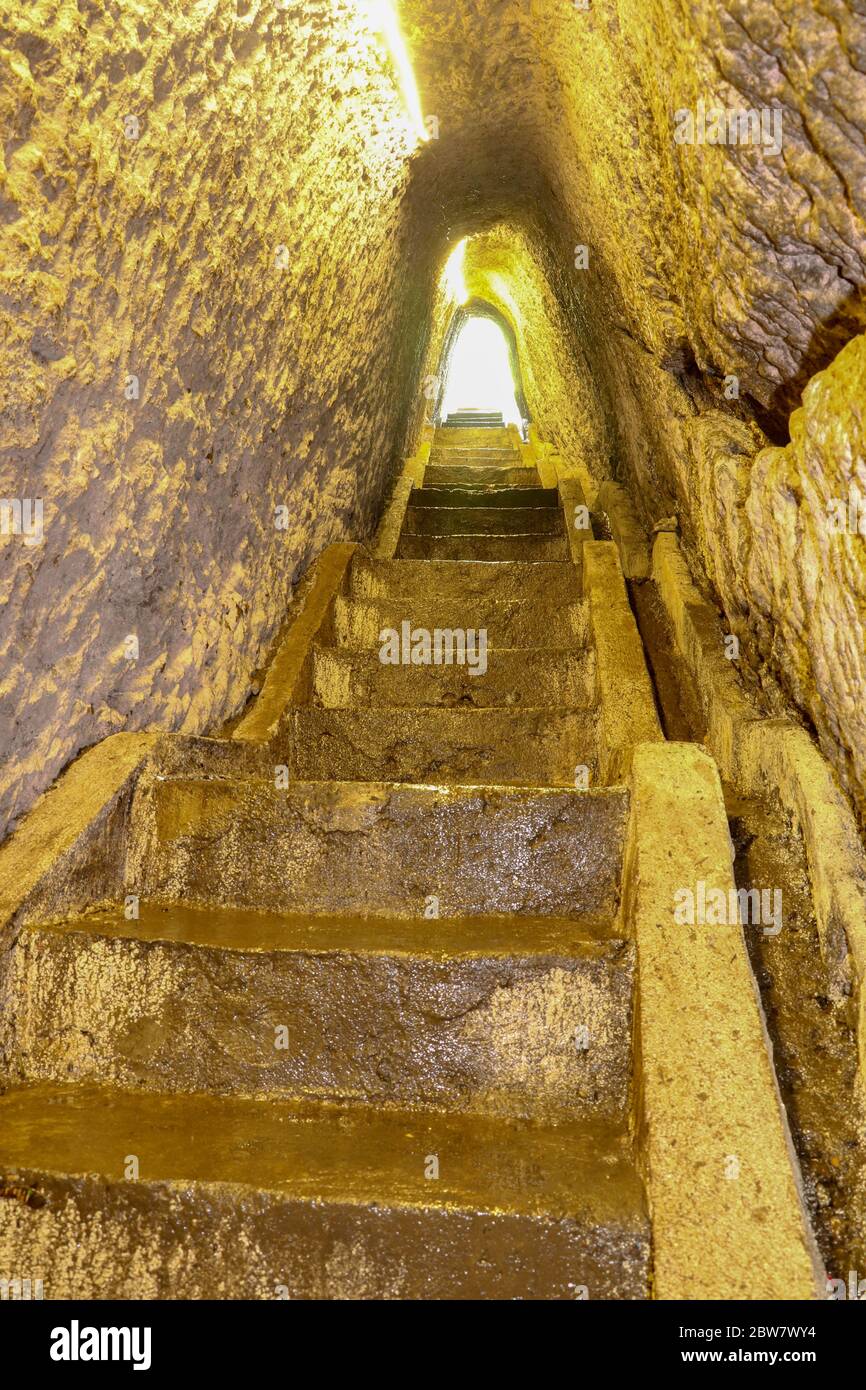 Access stairs to a cave. Stairs in a hand-carved tunnel into the Stock ...