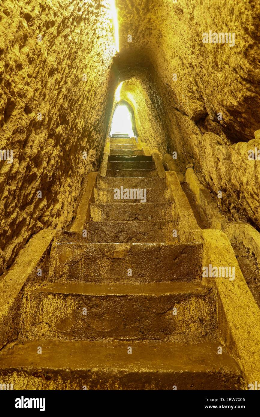 Access stairs to a cave. Stairs in a hand-carved tunnel into the Stock ...