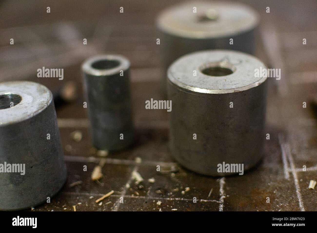 four machining dies on a workbench in a fabrication shop Stock Photo ...