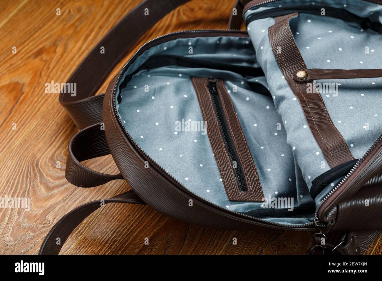 An empty handmade genuine leather backpack is open for things Stock ...