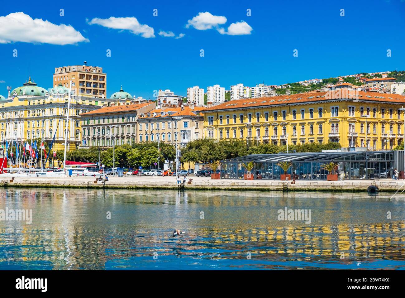 Waterfront view of the city of Rijeka, Croatia. Boats in marina and old ...