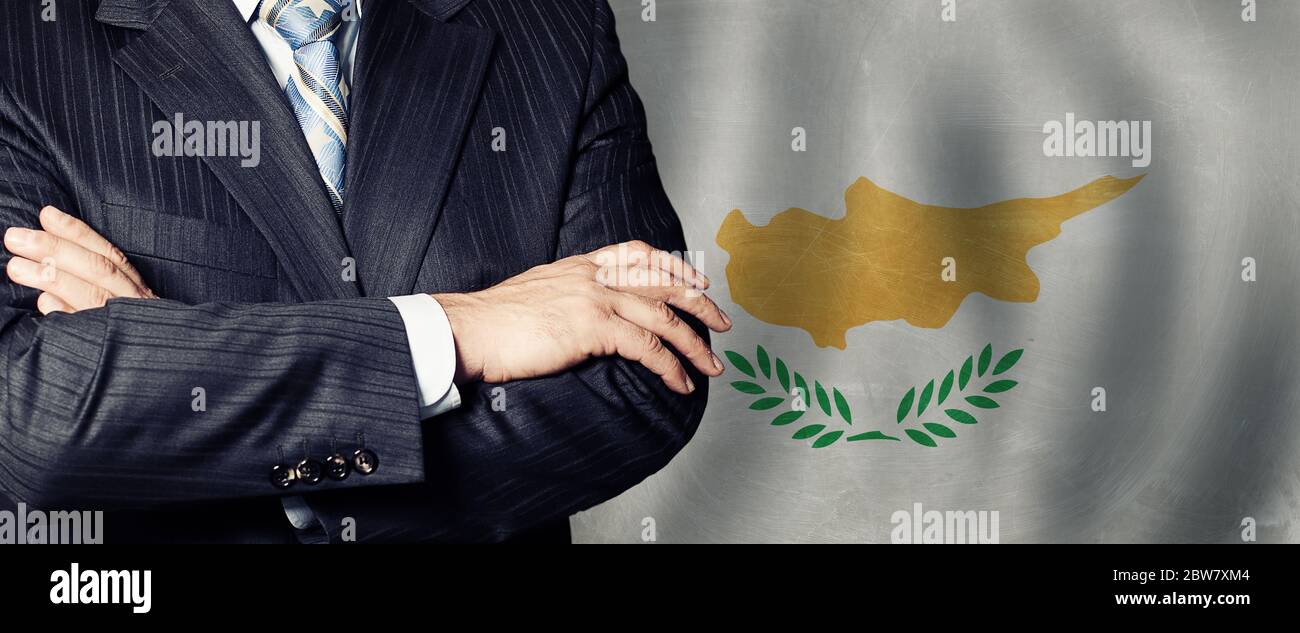Male hands against Cypriot flag background, business, politics and ...
