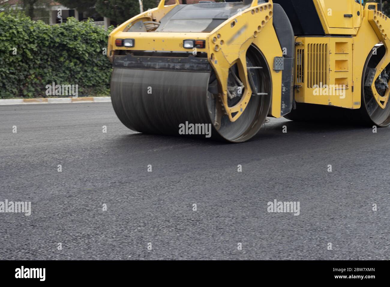 New asphalt road. Road asphalt works. Construction works Stock Photo ...