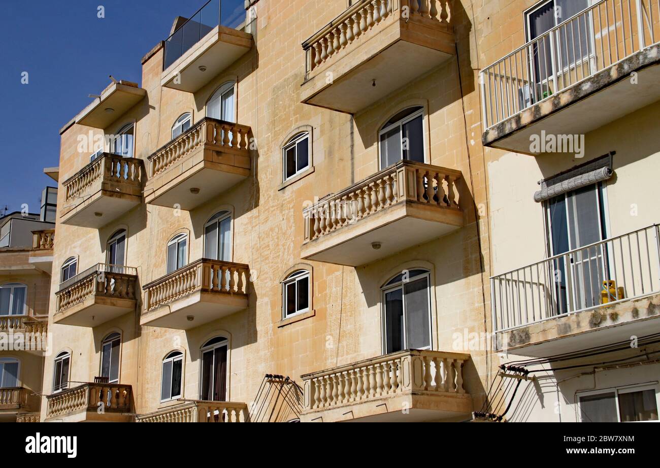 VALLETTA, MALTA - NOVEMBER 15TH 2019: Balconies with stone balustrades ...