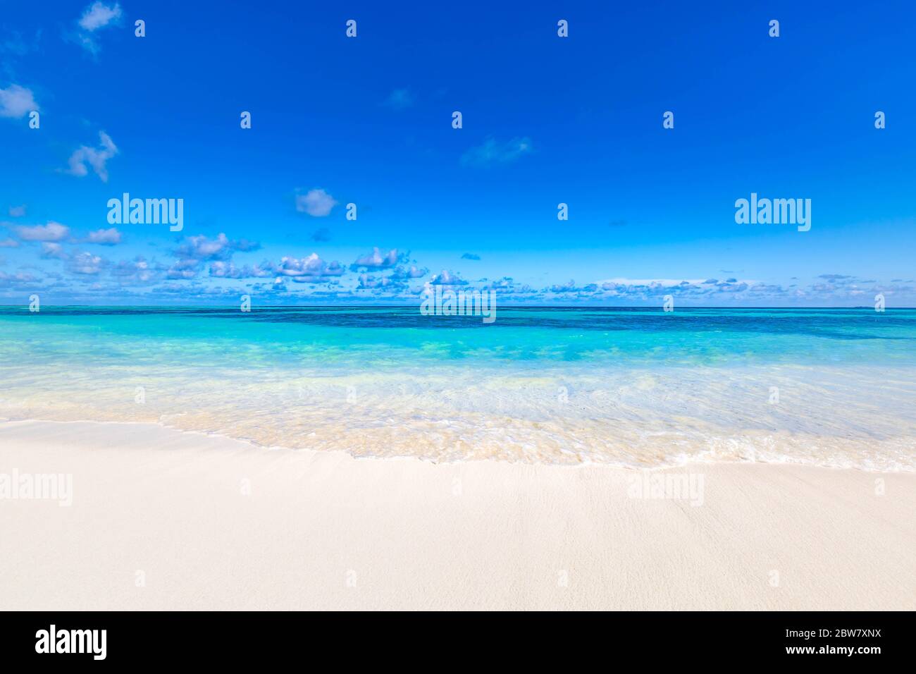 Empty tropical beach with soft waves splashing background. Horizon with ...