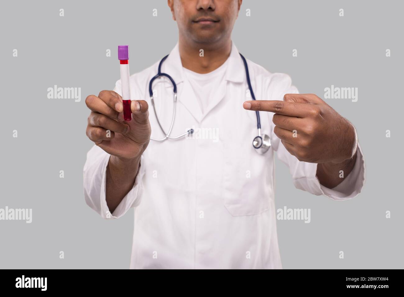 Indian Man Doctor Pointing at Blood Tube Analysis Close Up. Science ...