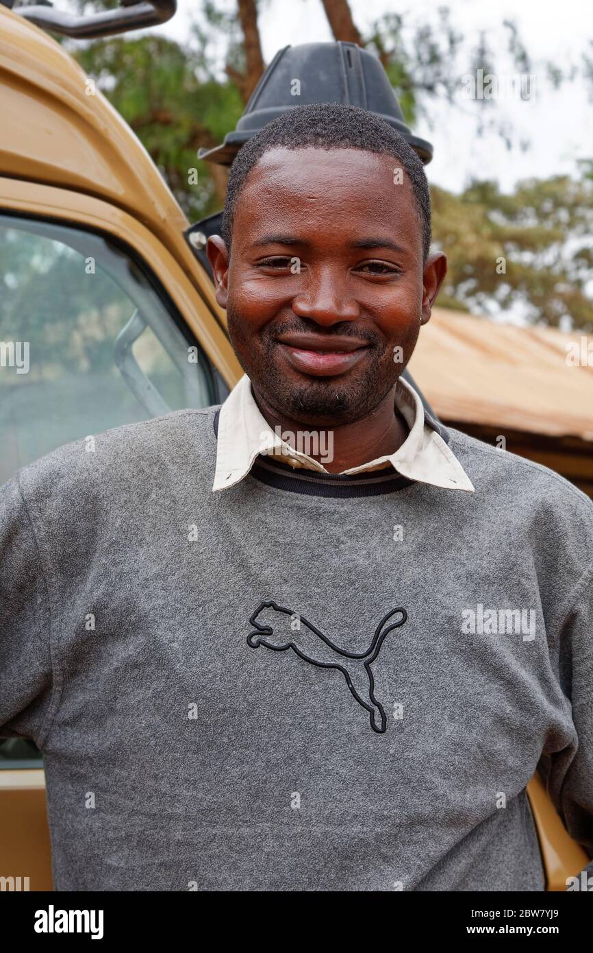 man smiling, happy, casual portrait, tour guide, Tanzania; Africa; MR ...
