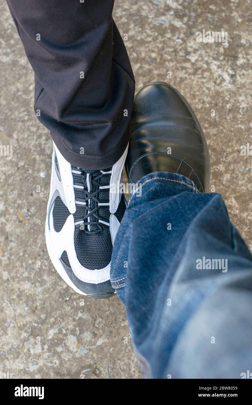 safe-pandemic-greeting-concept-two-legs-touching-each-other-top-view