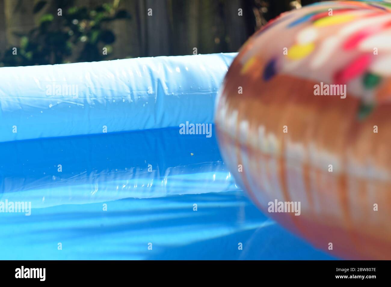 Donut float in Inflatable Pool in the garden Stock Photo - Alamy