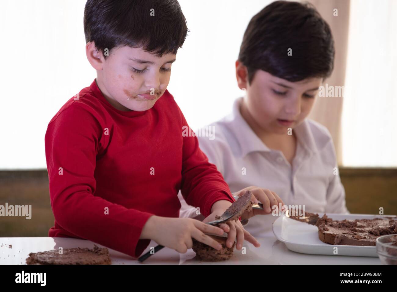 kids boy making cake bakery in kitchen Stock Photo - Alamy