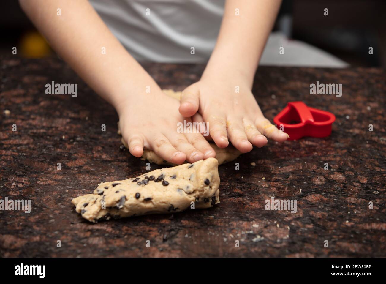 Close up child hands preparing cookies at kitchen Stock Photo - Alamy