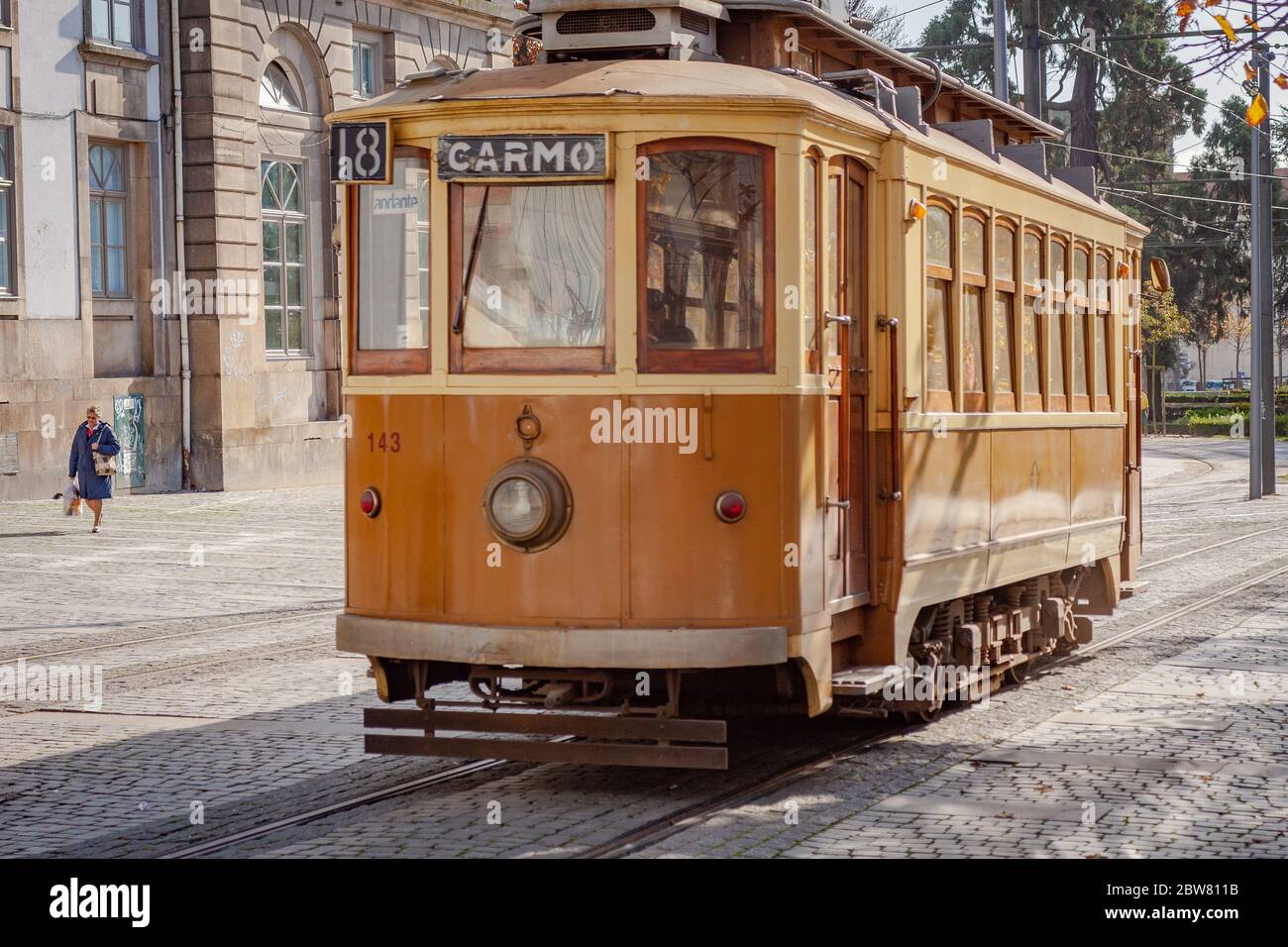 Old yellow tram carriage nr 18 on the street of Porto, Portugal Stock ...