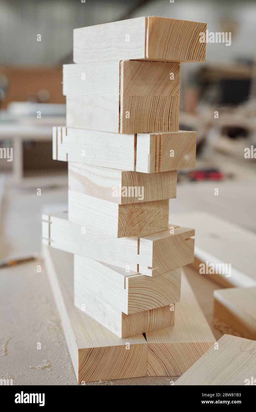 Stack of wooden brick workpieces ready to be used in production of ...