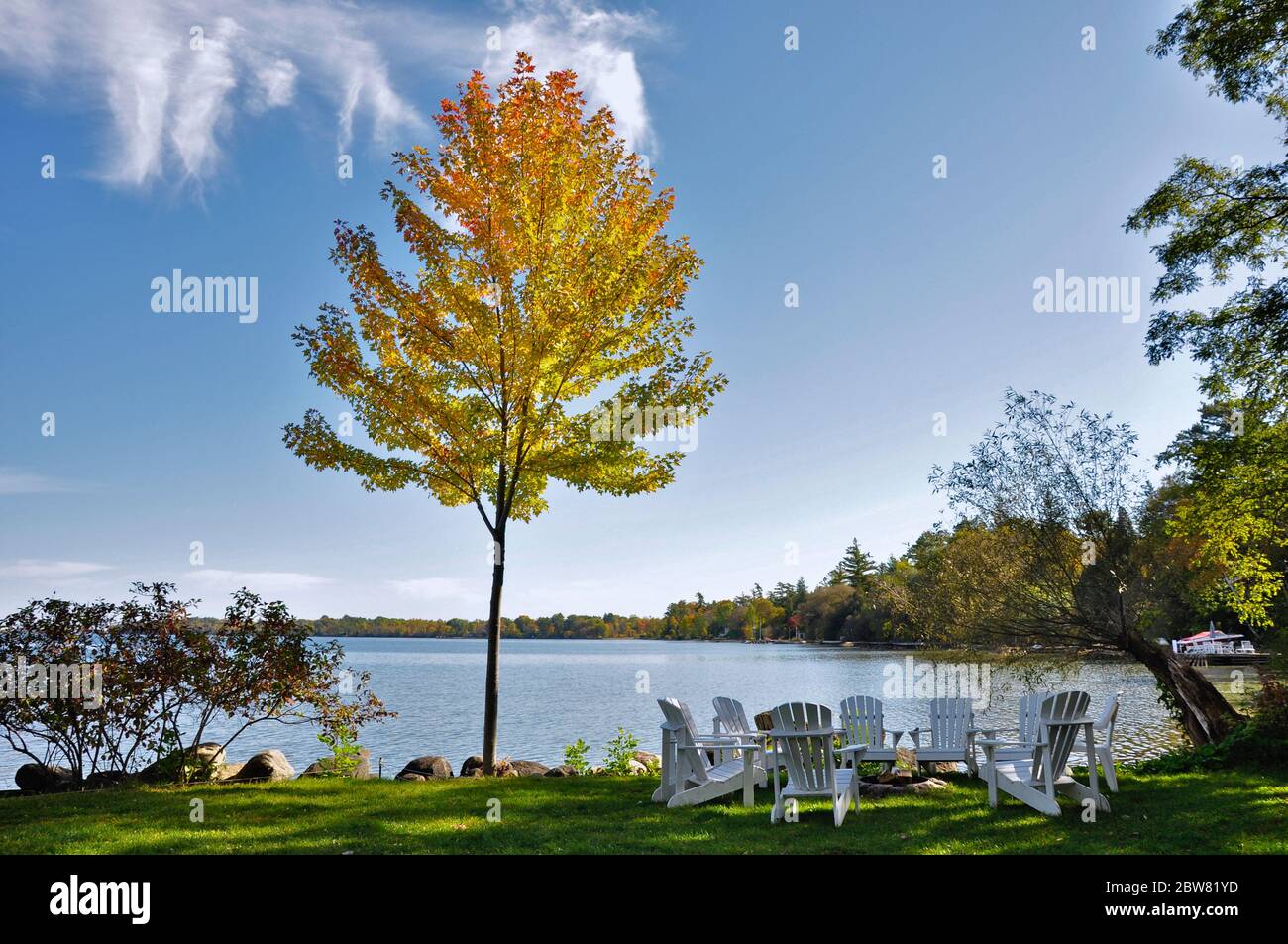 The lakefront campfire with Muskoka chairs in a tourist resort in ...