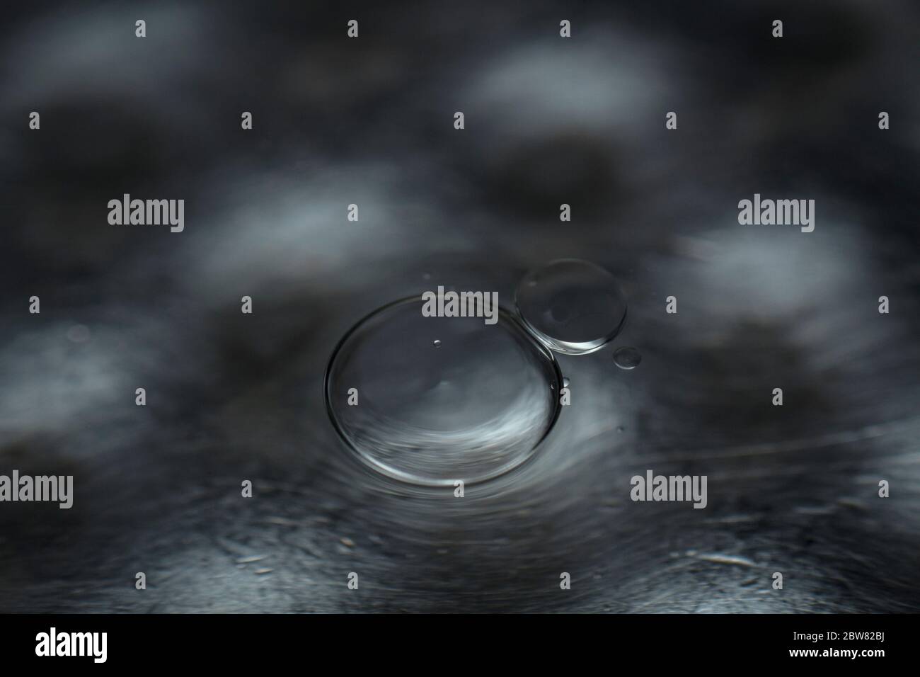 Floating cooking oil on the water surface Stock Photo - Alamy