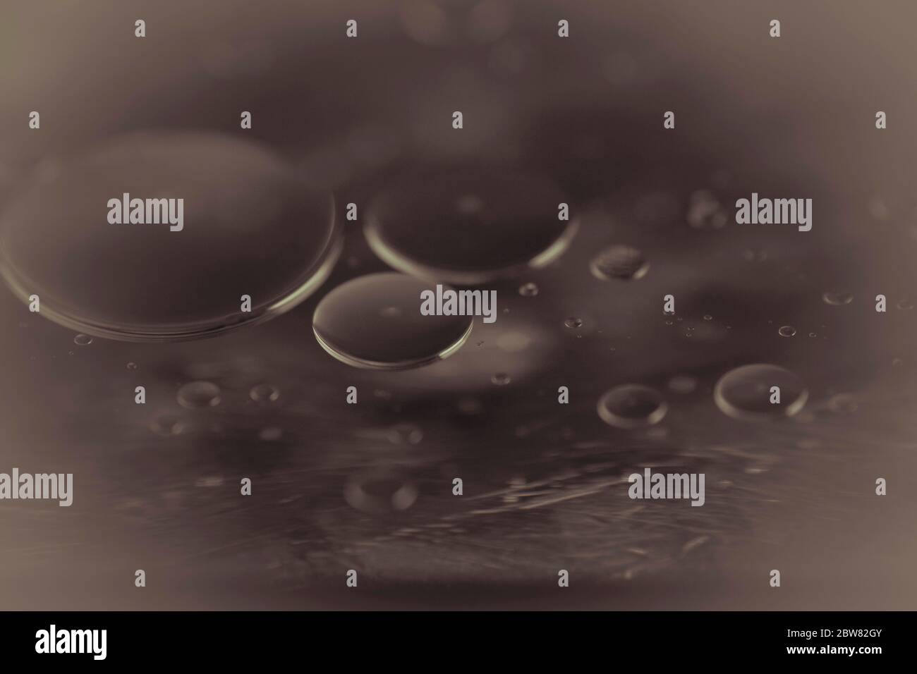 Floating cooking oil on the water surface Stock Photo - Alamy