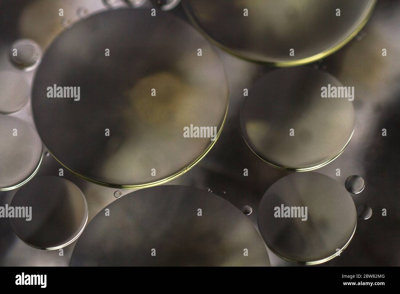 Floating cooking oil on the water surface Stock Photo - Alamy