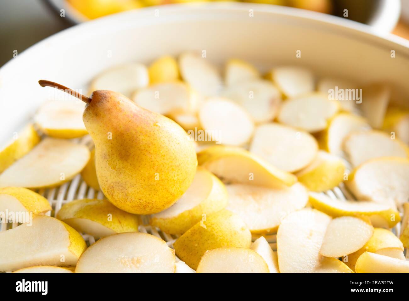 Homemade drying dehydration process of pears in slices Stock Photo - Alamy