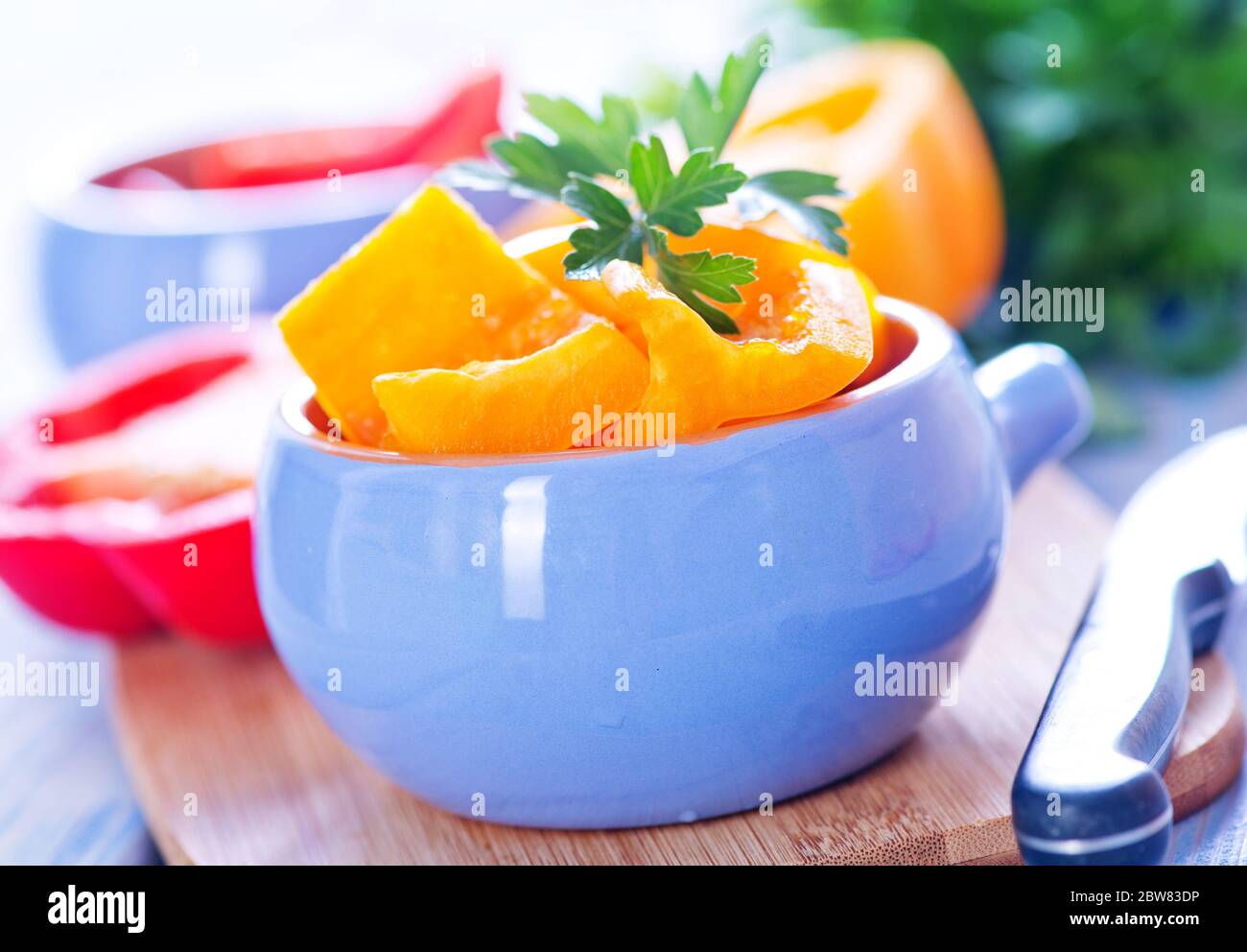 raw pepper in bowl and on a table Stock Photo - Alamy