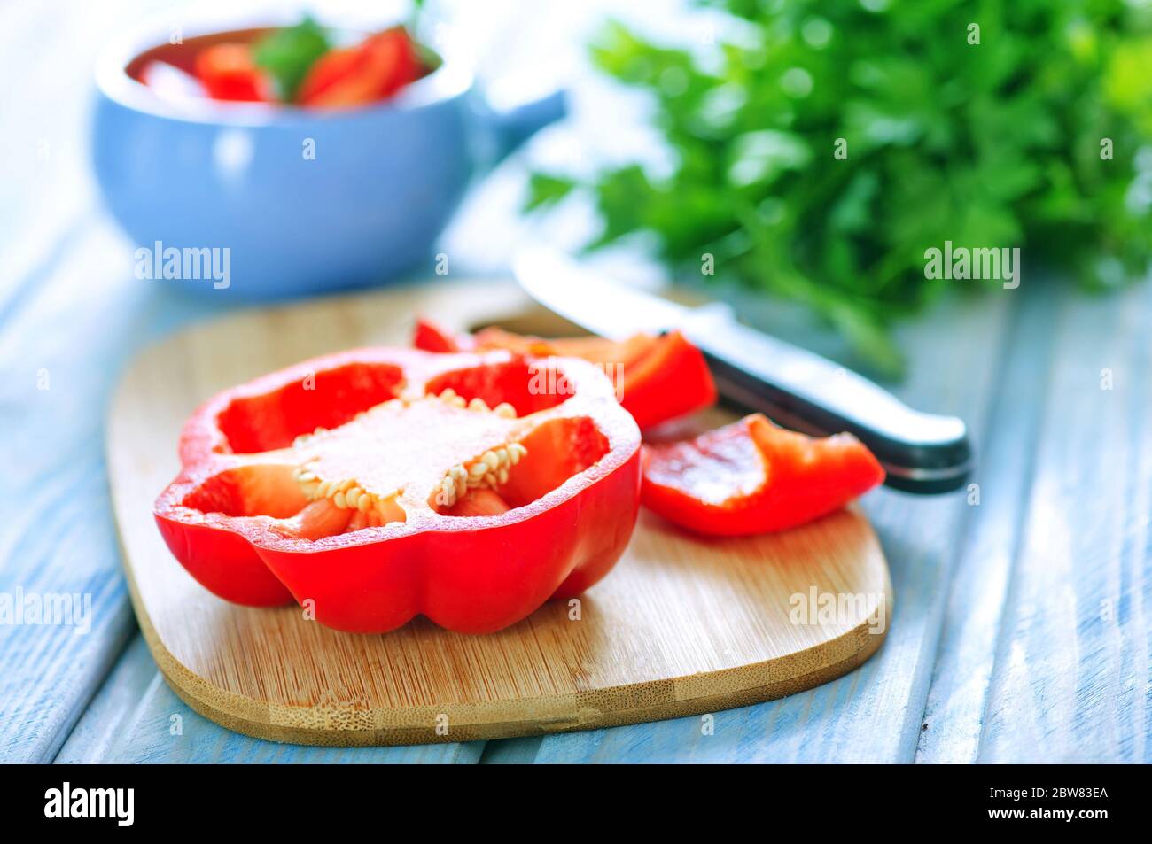 raw pepper in bowl and on a table Stock Photo - Alamy