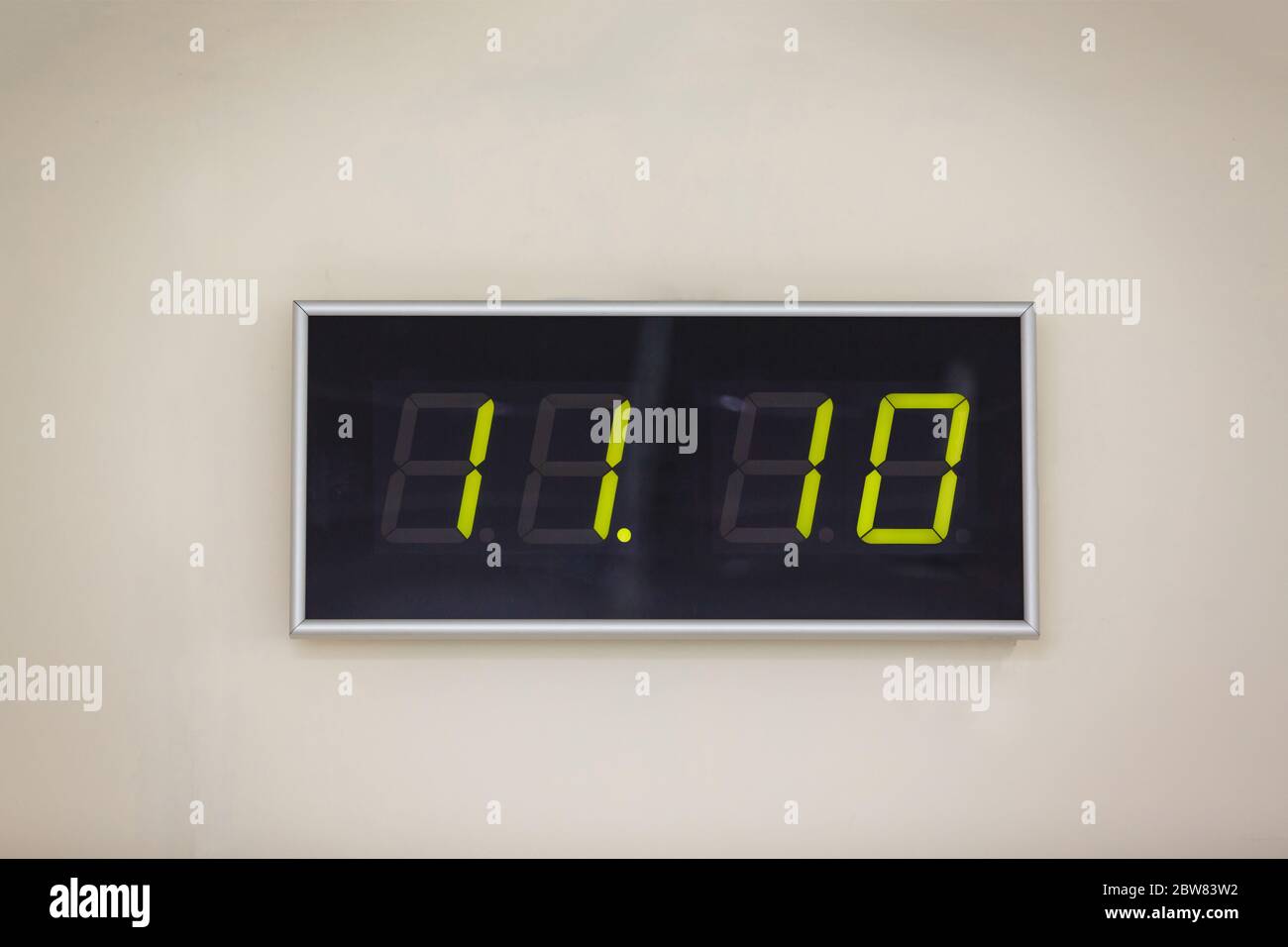 Black digital clock on a white background showing time 11:10 Stock ...