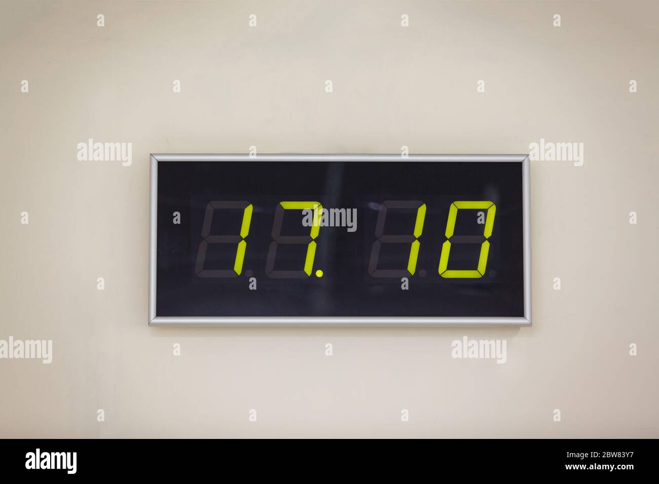 Black digital clock on a white background showing time 17:10 Stock ...