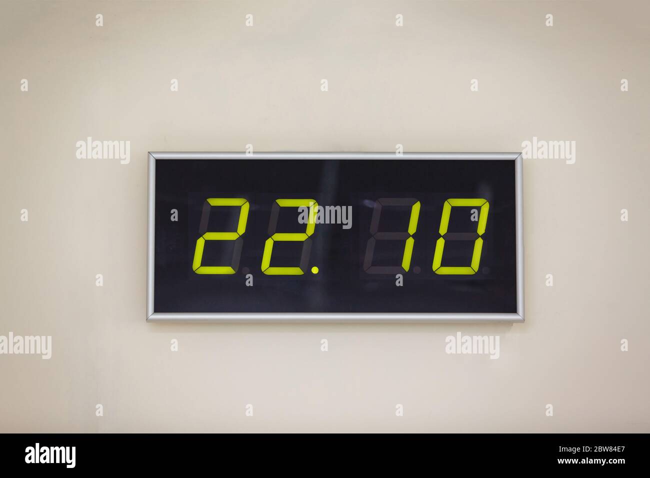 Black digital clock on a white background showing time 22:10 Stock ...