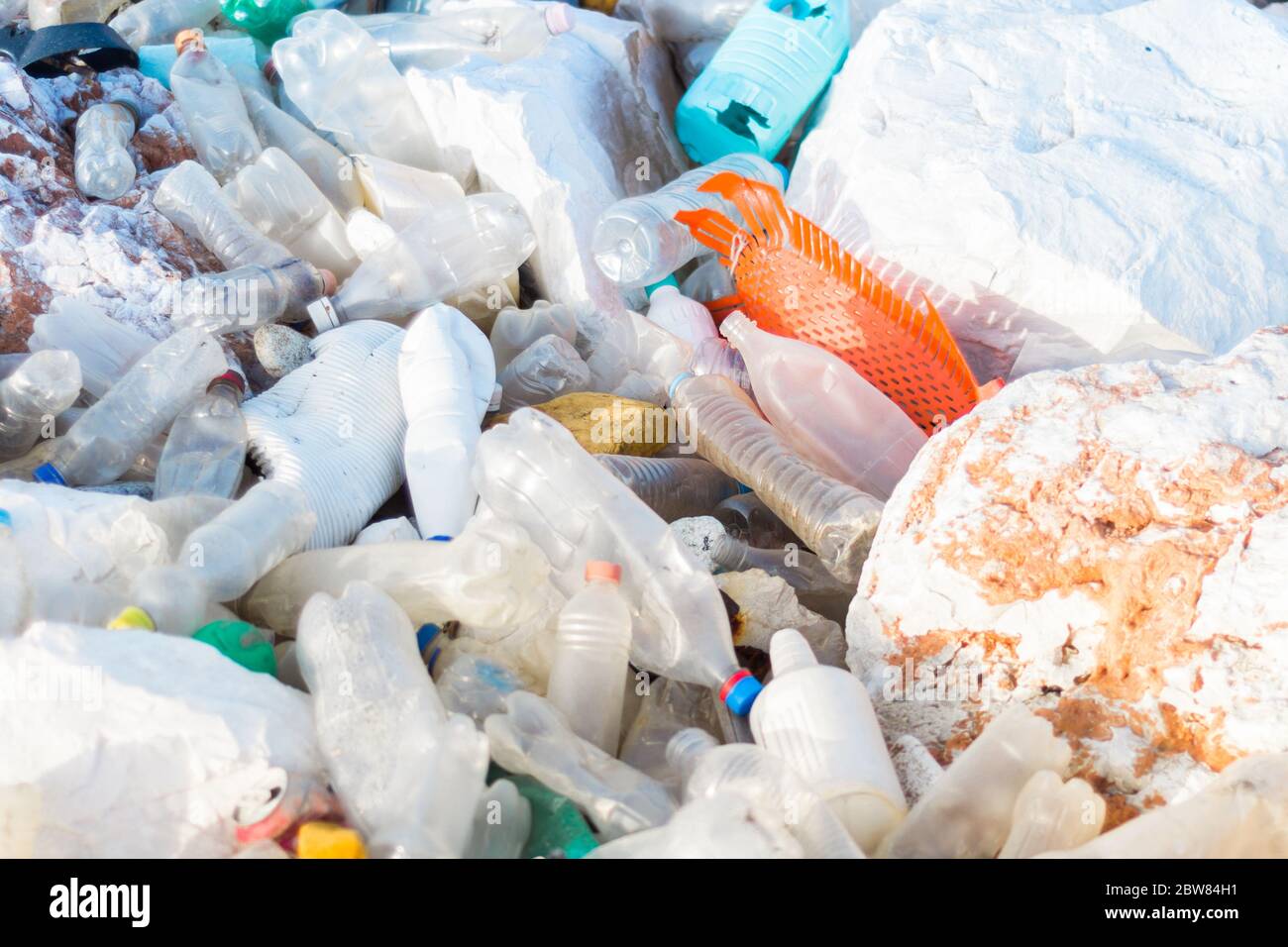 Shot of plastic waste washed out by the sea in the sea shore Stock ...