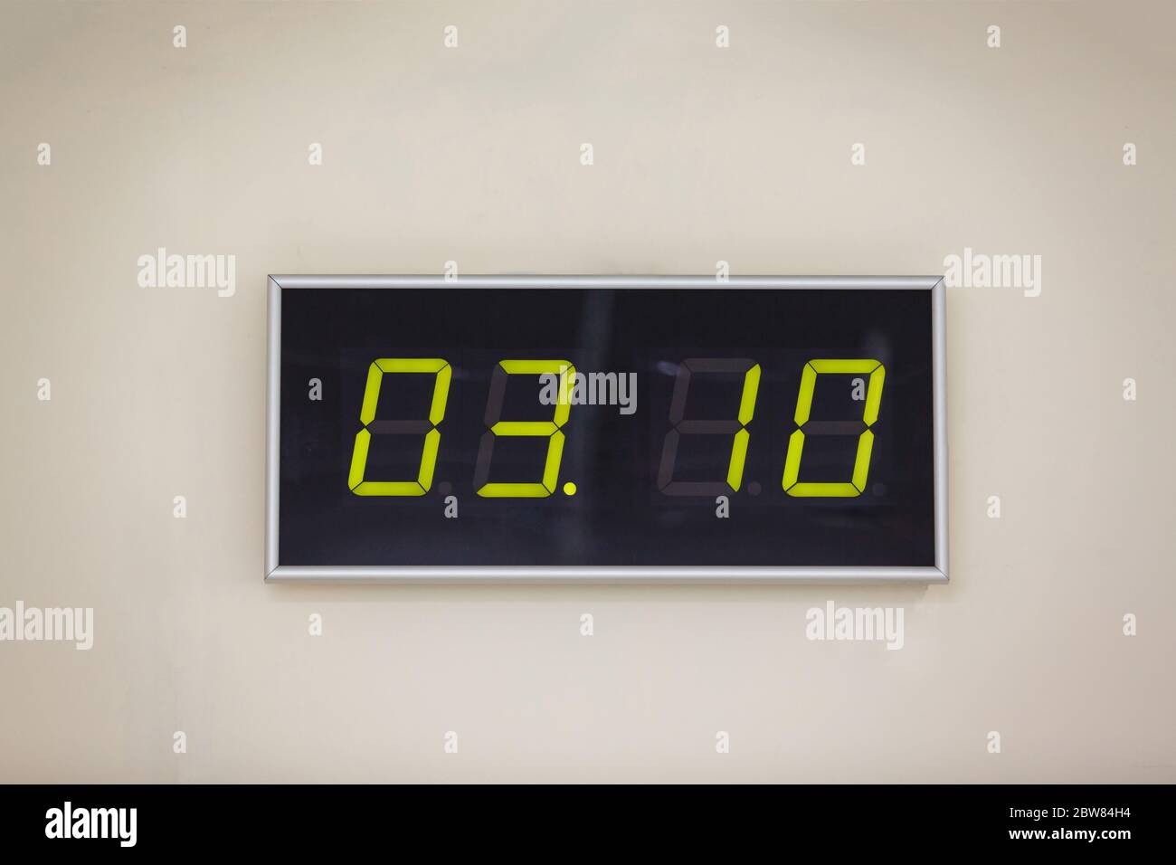 Black digital clock on a white background showing time 03:10 Stock ...