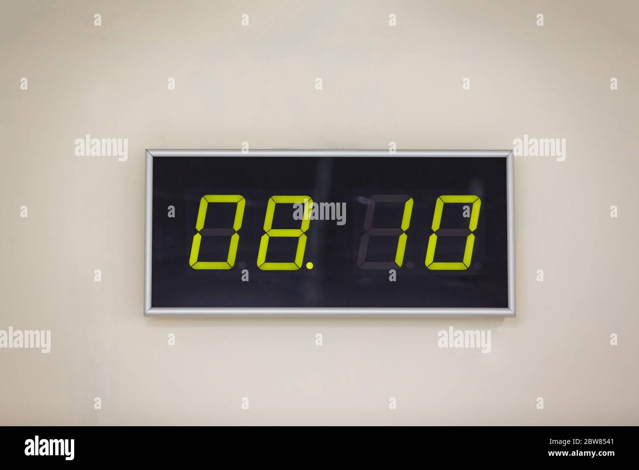 Black digital clock on a white background showing time 08:10 Stock ...