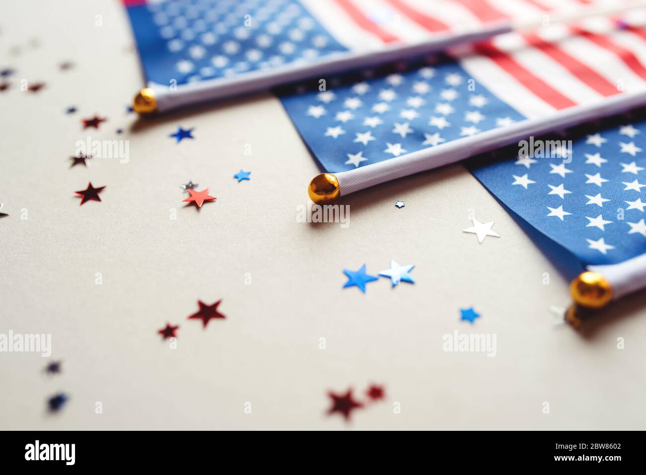 Festive background with US flags and confetti Stock Photo - Alamy