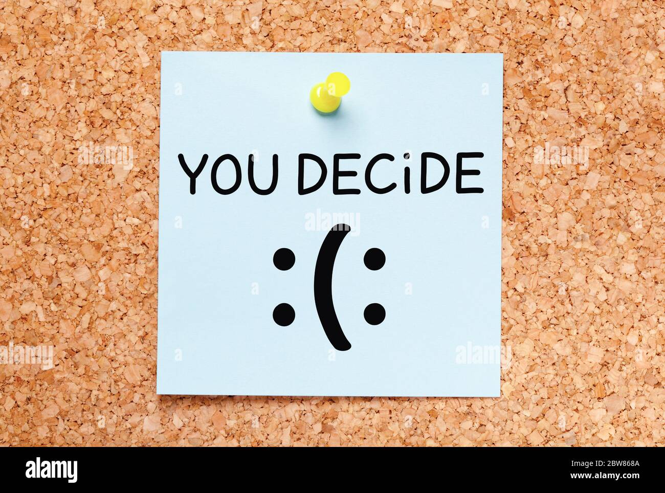 Happy Or Sad You Decide concept handwritten on blue sticky note pinned ...