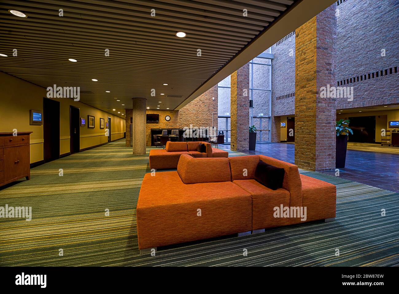 Interior Hotel Lobby and Conference Space with Warm Tone Decor and Cool ...