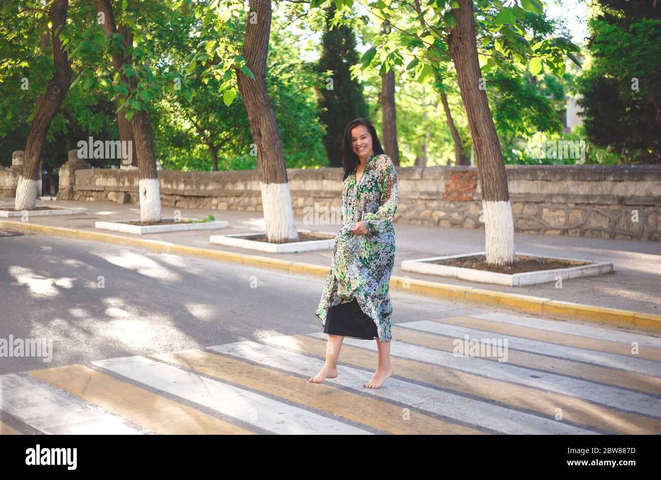 Happy tourist walking barefoot the city hi-res stock photography and ...