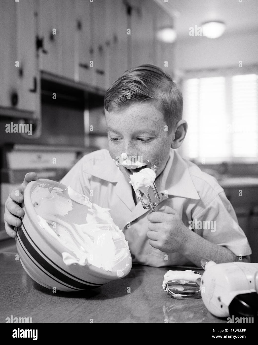 1950s FRECKLE FACE BOY IN KITCHEN LICKING CLEAN THE WHIPPING CREAM ...