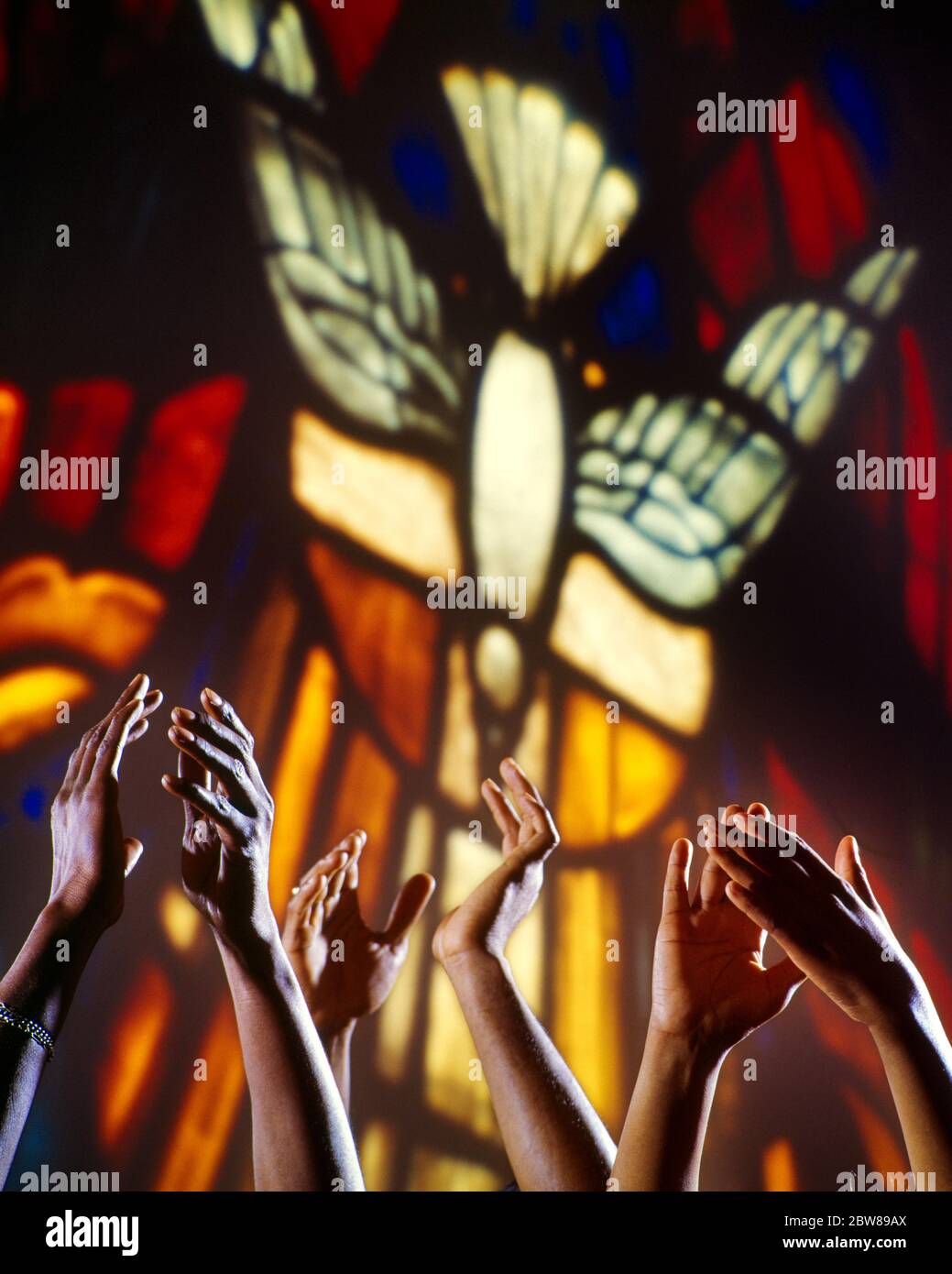 1970s AFRICAN AMERICAN HANDS RAISED IN PRAISE BEFORE STAINED GLASS ...