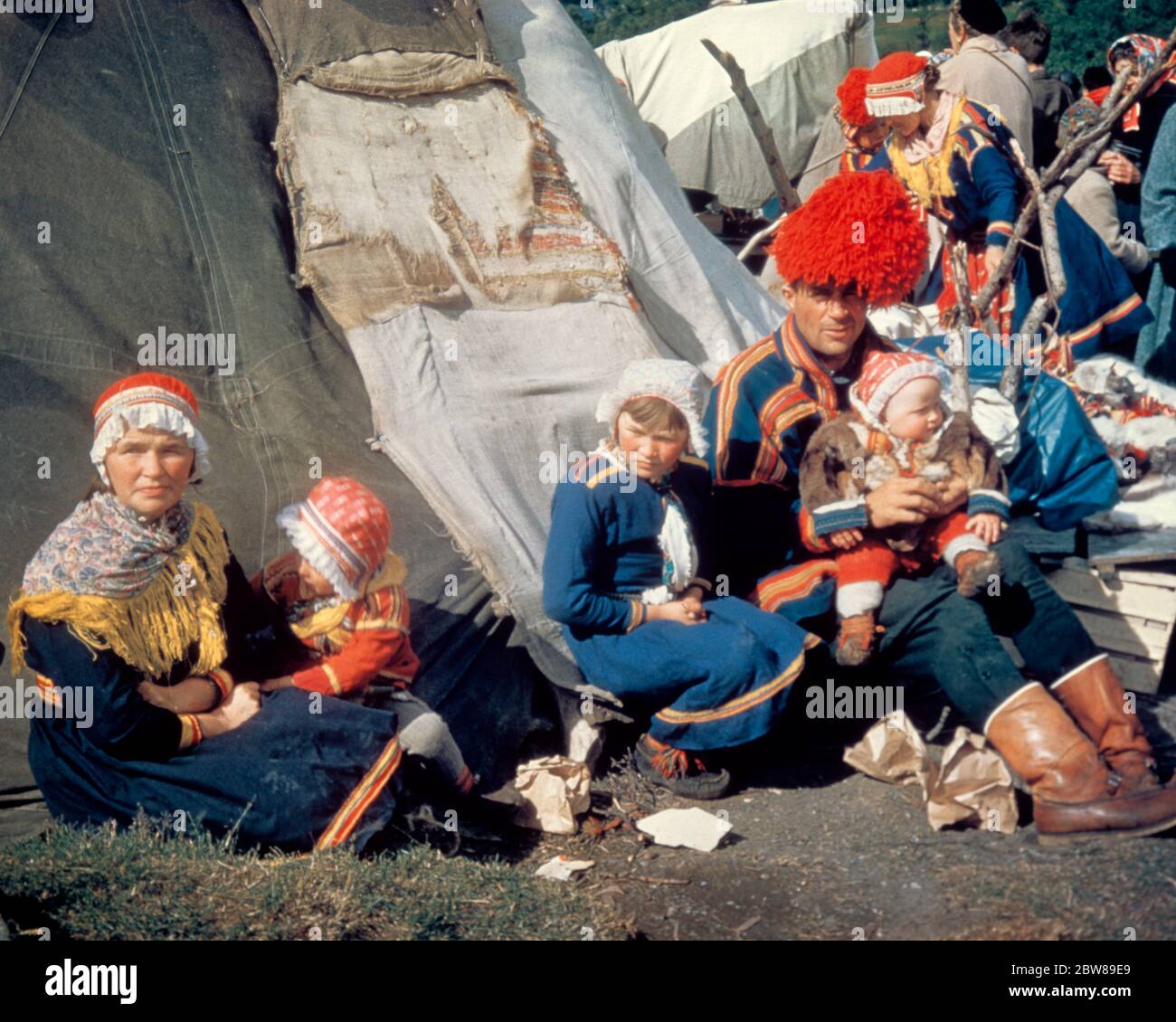 1950s SAMI FAMILY NORWAY DRESSED IN TRADIONAL CLOTHES RESTING AGAINST ...