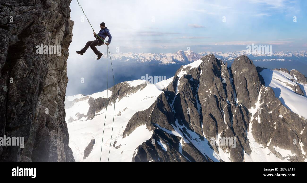 Fantasy Adventure Composite with a Man on top of a Mountain Cliff Stock ...