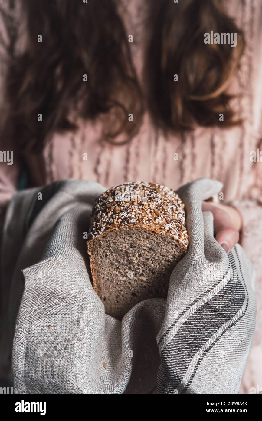 Woman holding loaf of bread hi-res stock photography and images - Alamy