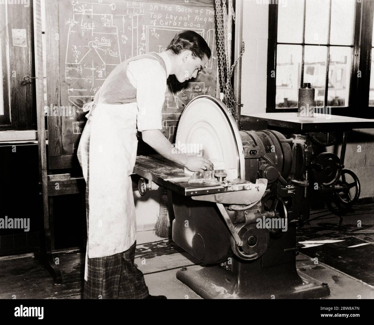 1940s YOUNG MAN VOCATIONAL STUDENT AT WORKING SANDING WHEEL IN PATTERN ...