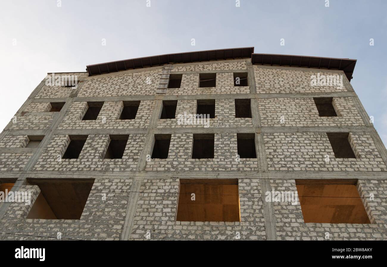 An unfinished building under construction, without windows Stock Photo ...
