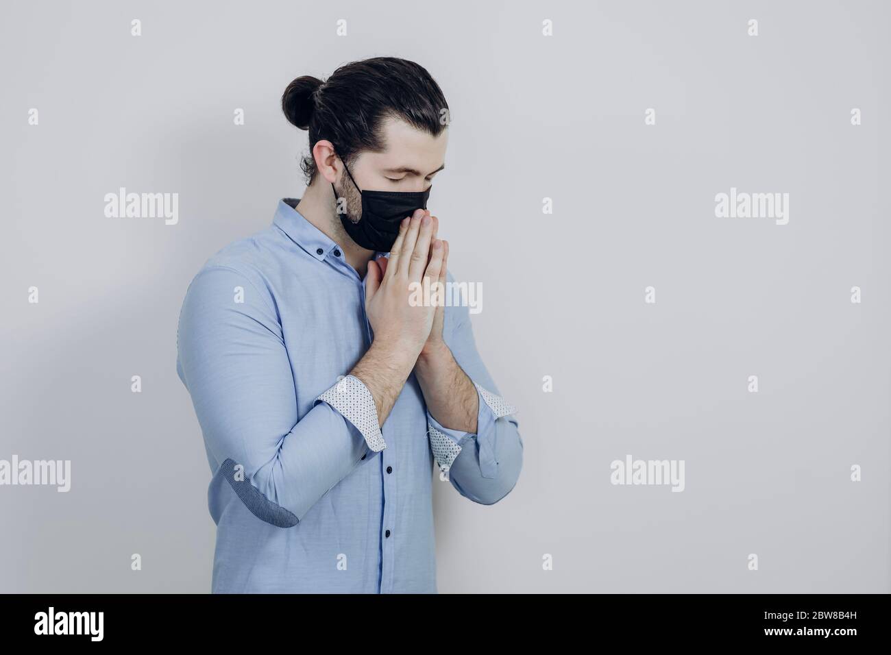 a man hairs holds his hands to his face and hopes for the best. When it ...