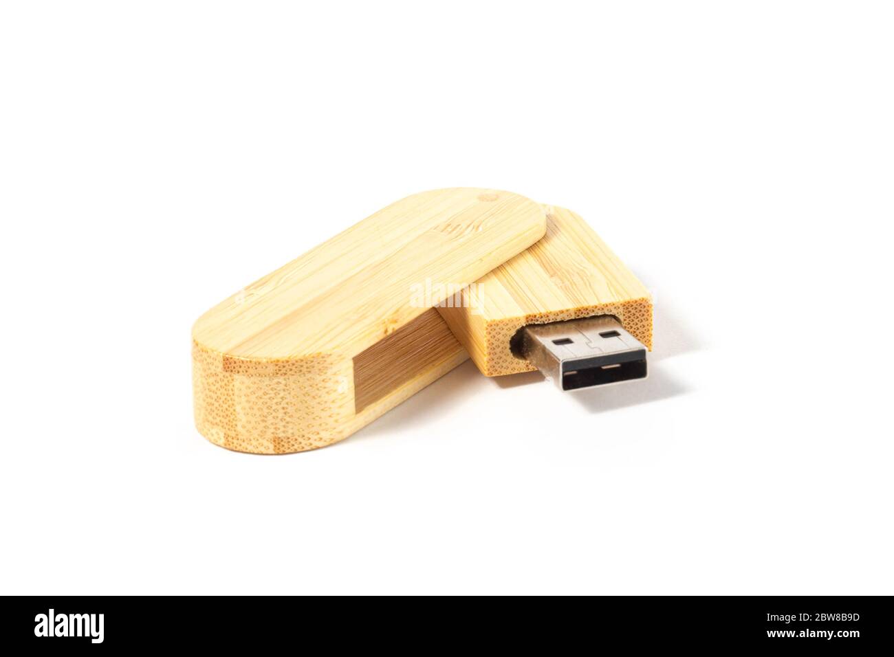 USB flash drive wooden of bamboo casing on a white background isolate ...