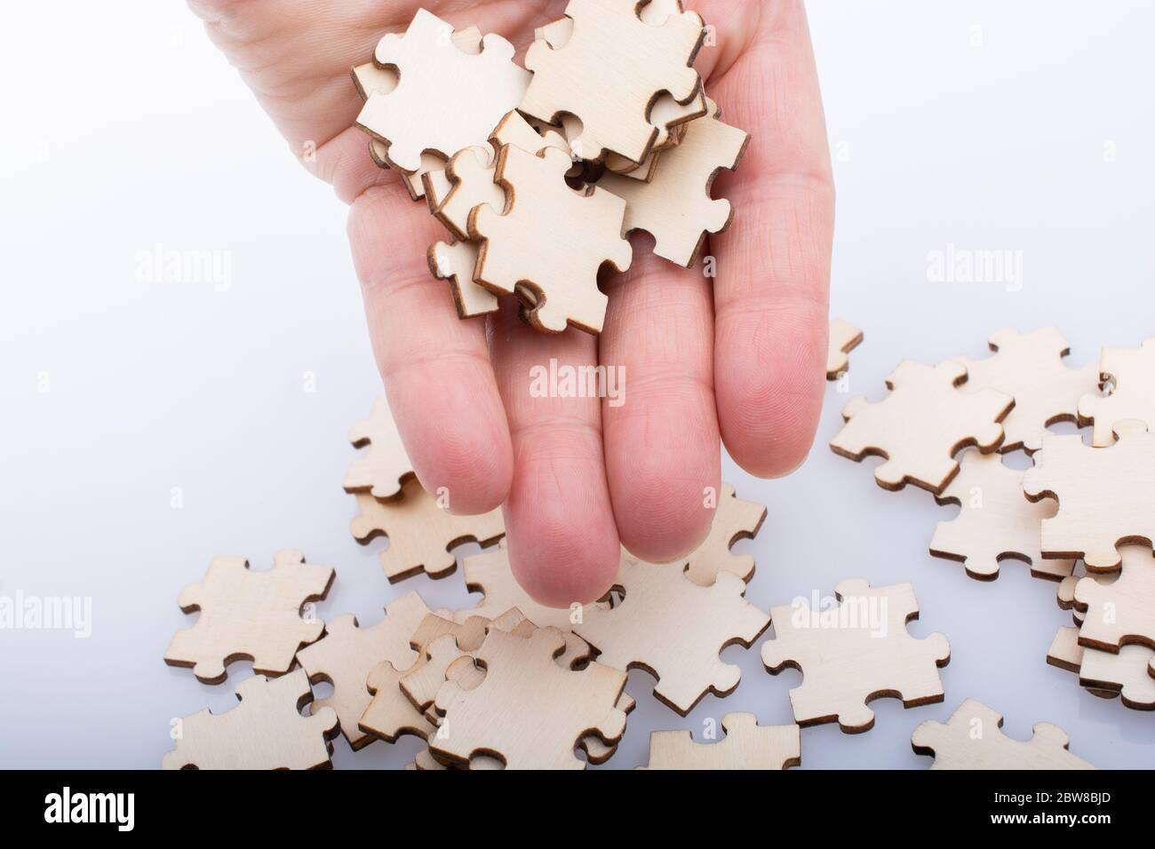 Hand holding piece of jigsaw puzzle as problem solution concept Stock ...
