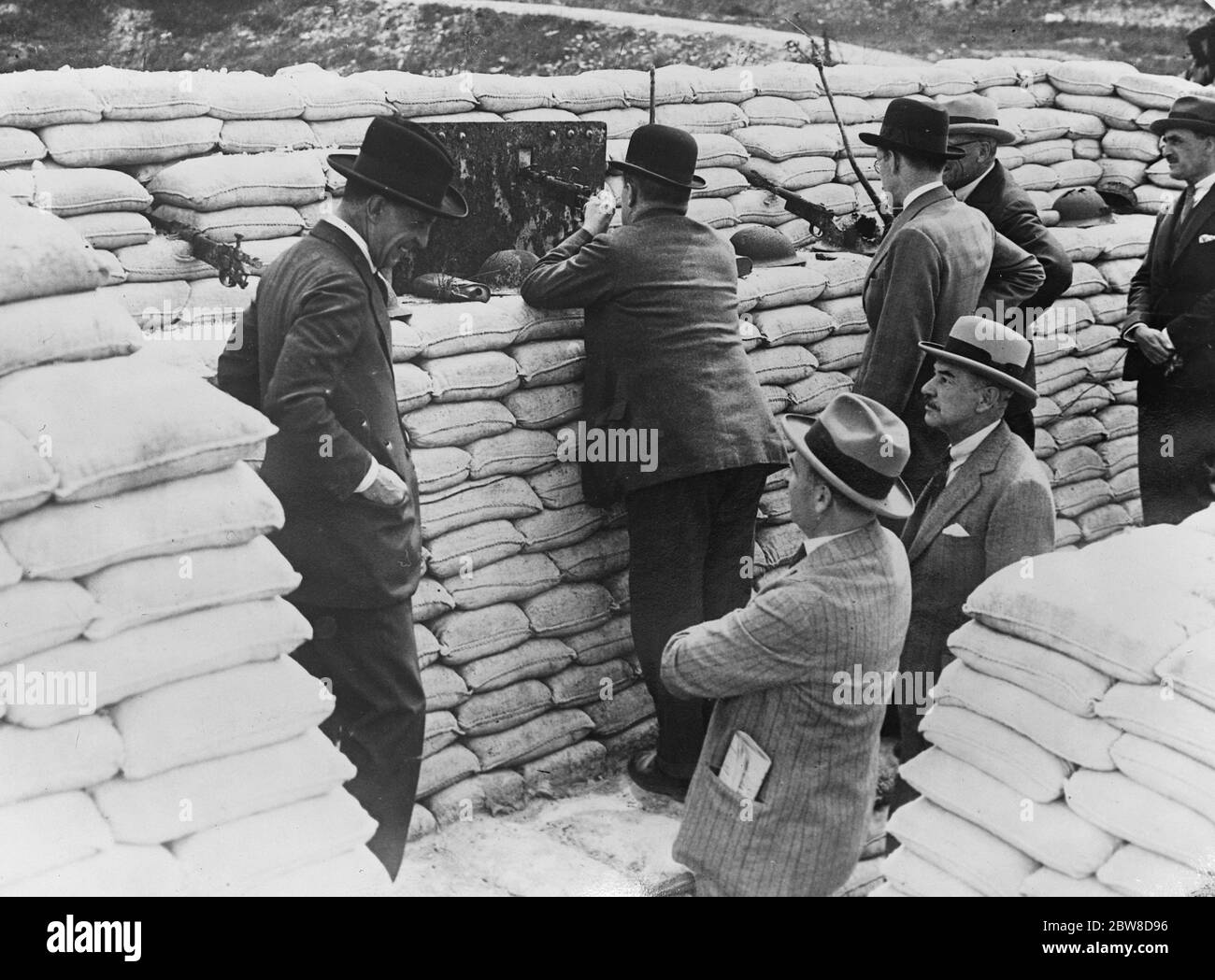 The Prime Minister in the trenches . Mr Stanley Baldwin handles a ...