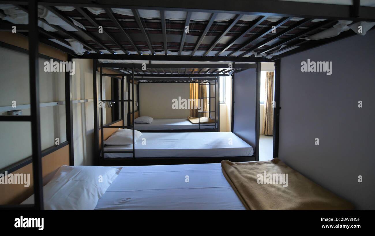 Empty room for a cheap hostel with bunk beds Stock Photo - Alamy