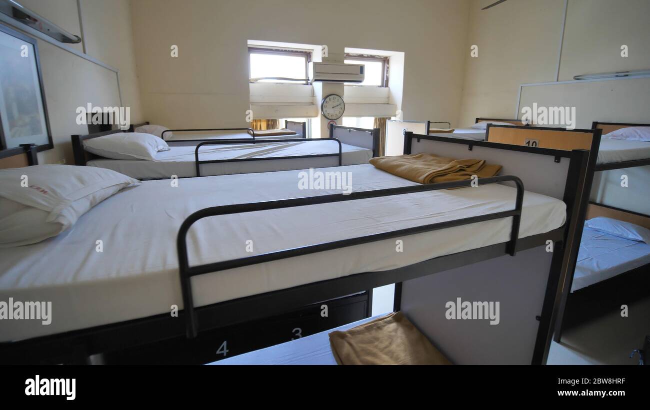 Empty room for a cheap hostel with bunk beds Stock Photo - Alamy