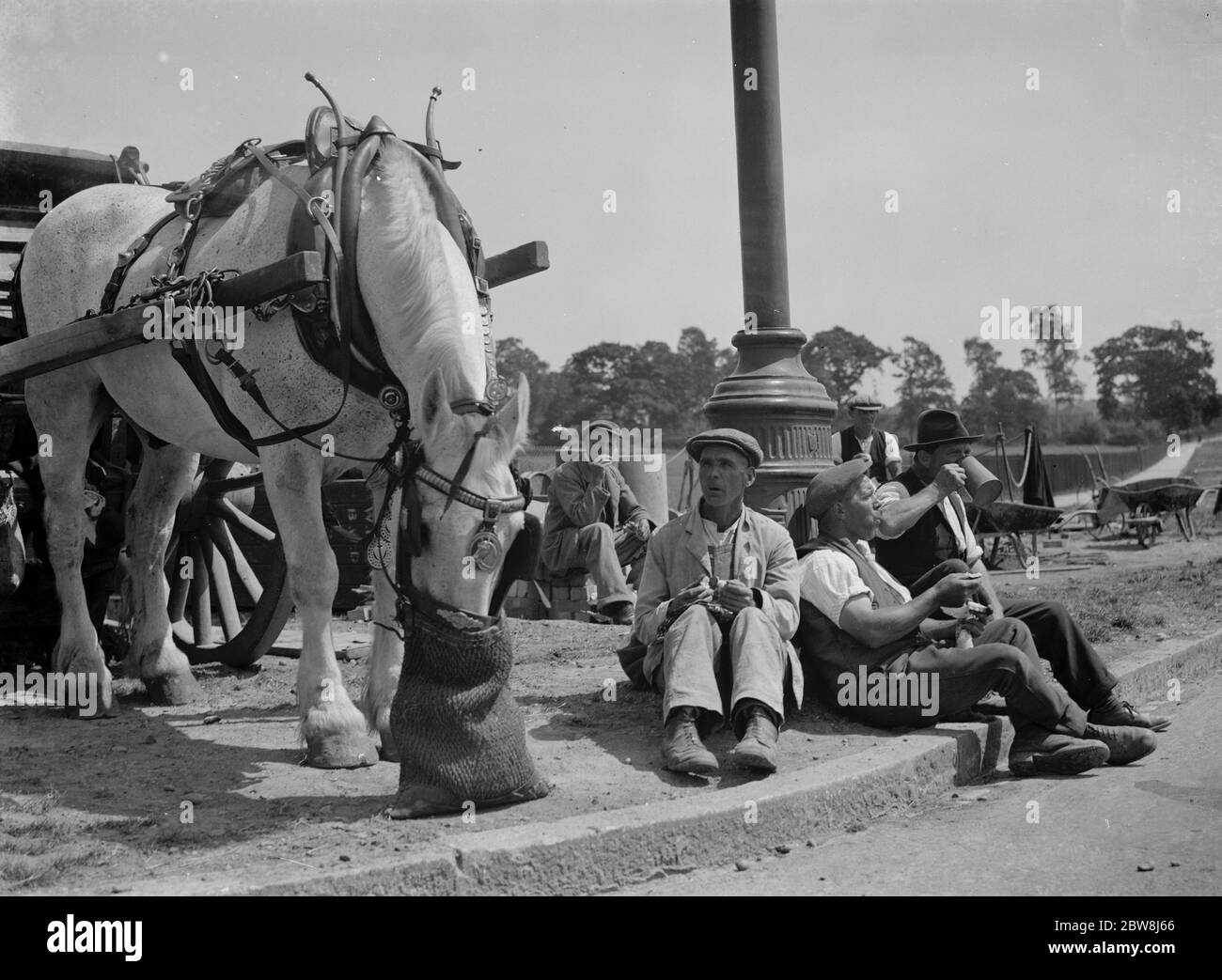 Road men taking tea in Eltham . 14 July 1937 Stock Photo - Alamy
