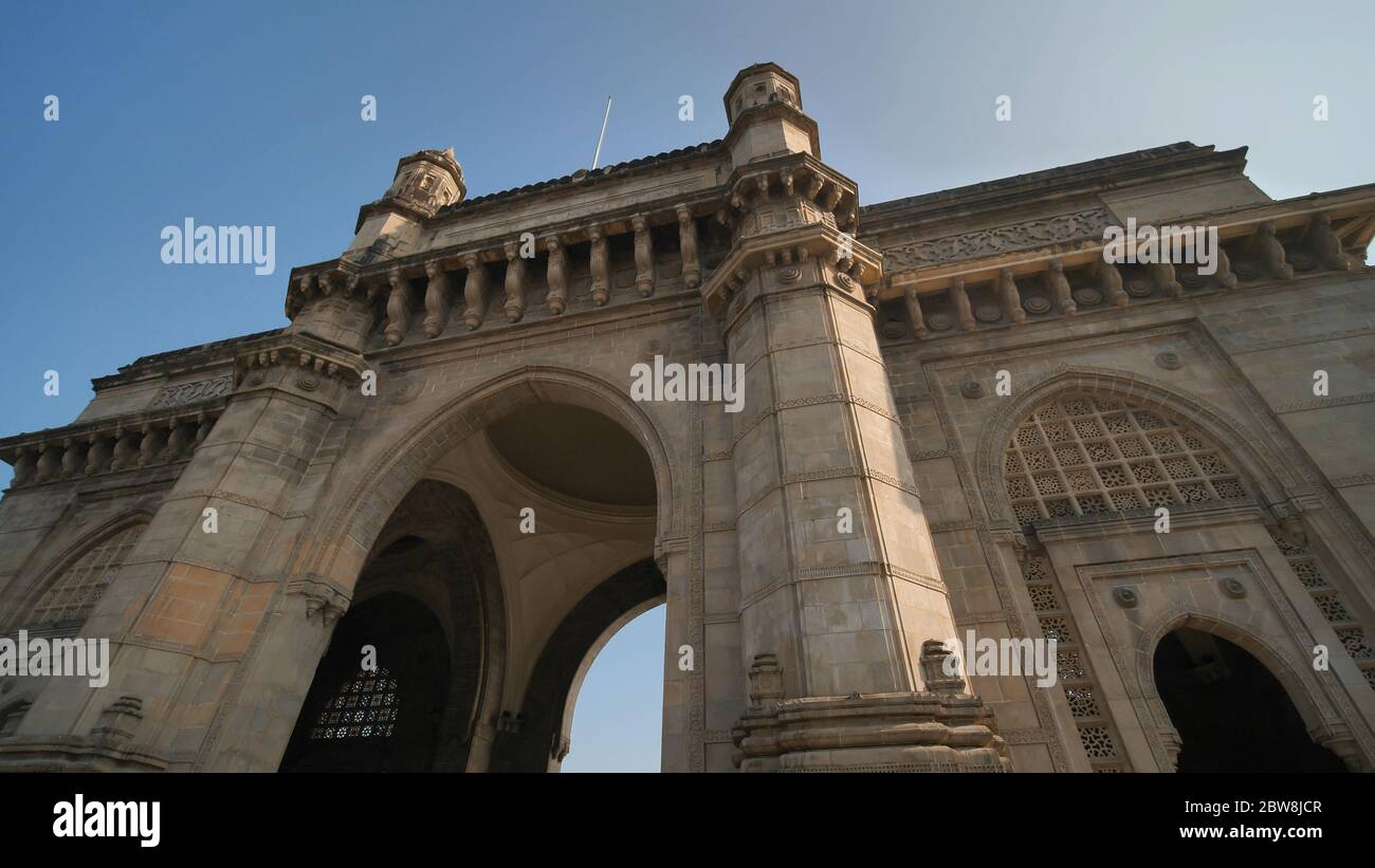 Gate of India in Mumbai against a blue sky Stock Photo - Alamy